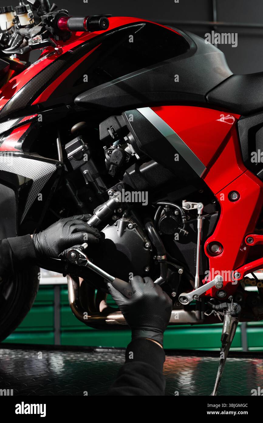 Motorcycle crankcase inspection with ratchet wrench ensures performance ...