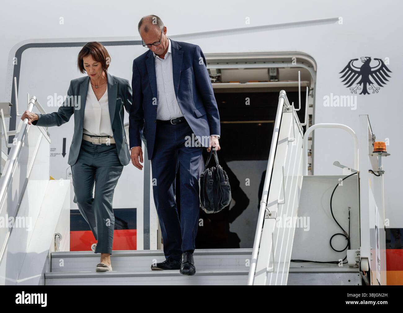 German Chancellor Friedrich Merz, right, and his wife Charlotte Merz ...