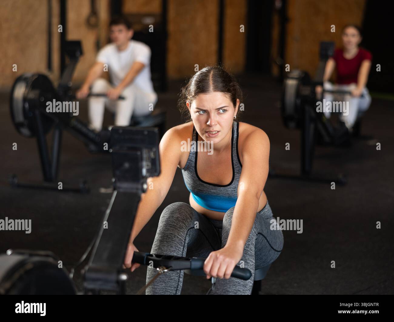 Focused female athlete exercising arms hi-res stock photography and ...