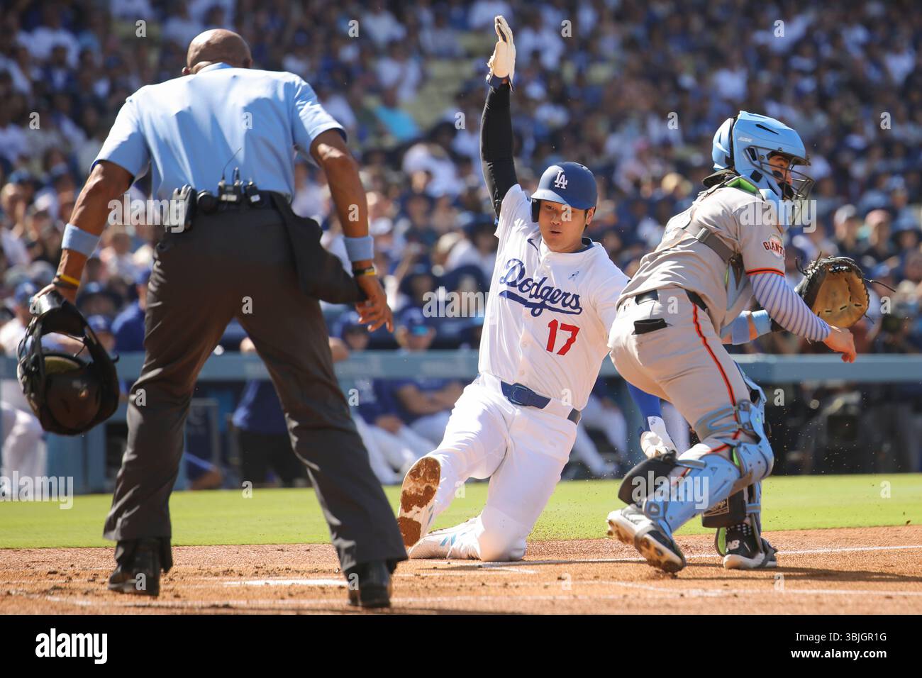 Los Angeles Dodgers designated hitter Shohei Ohtani (17) slides into ...