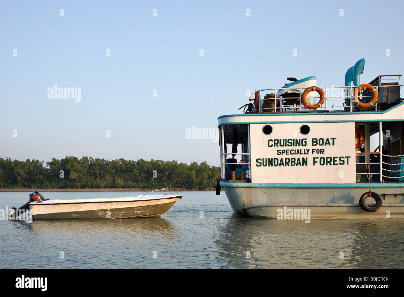 Cruising boat “ML Bon Bibi” docked near the mangrove edge in the ...