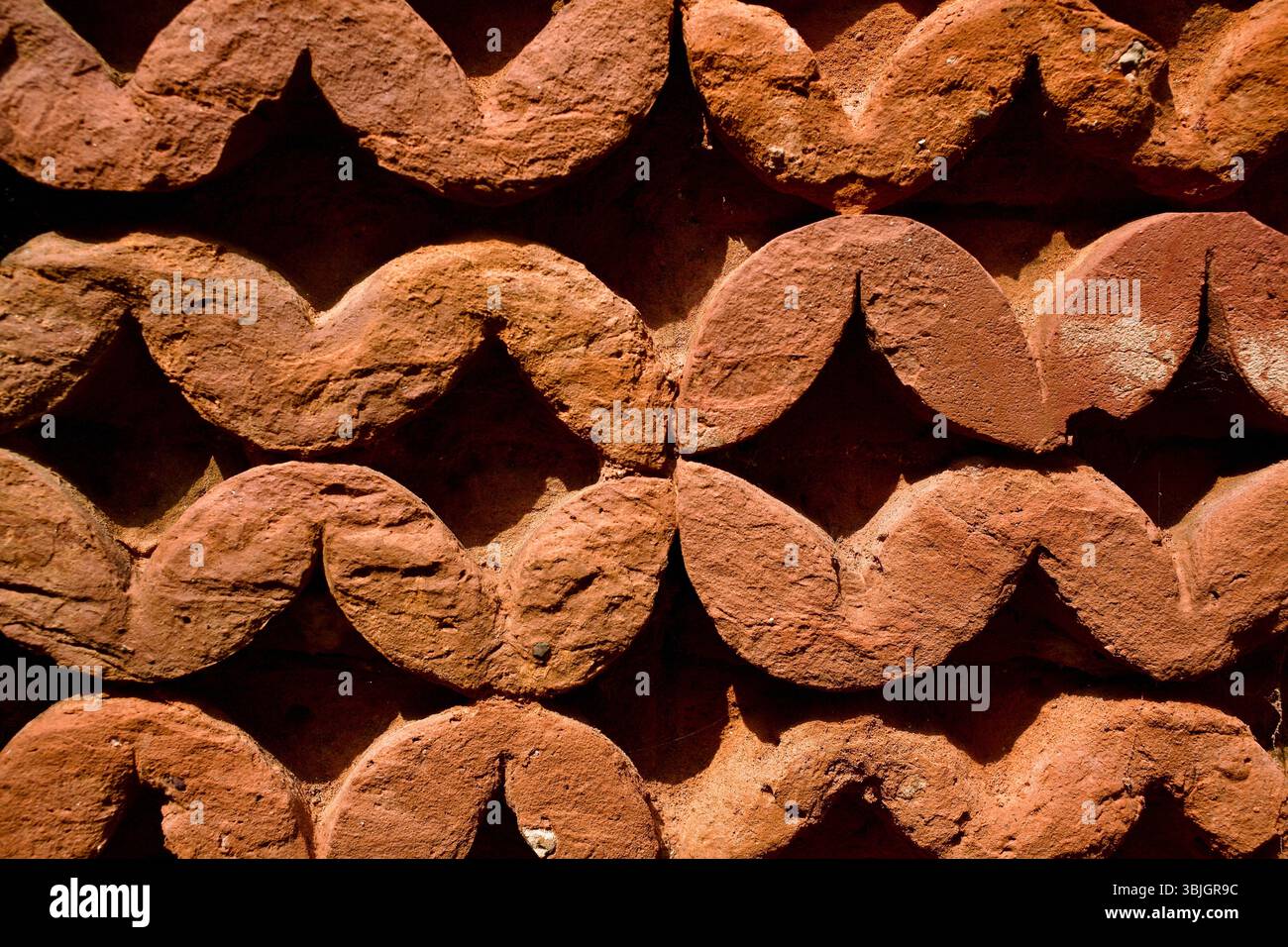 Close-up of terracotta ornamentation on the Nine-Dome Mosque in ...