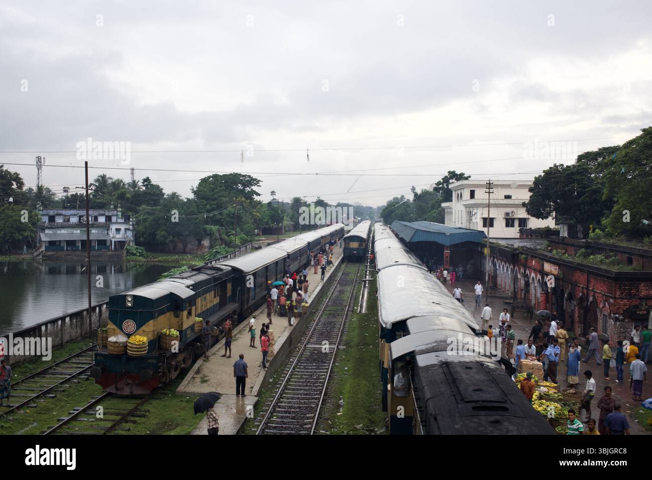 Passengers board and disembark at Jessore railway station, Bangladesh ...