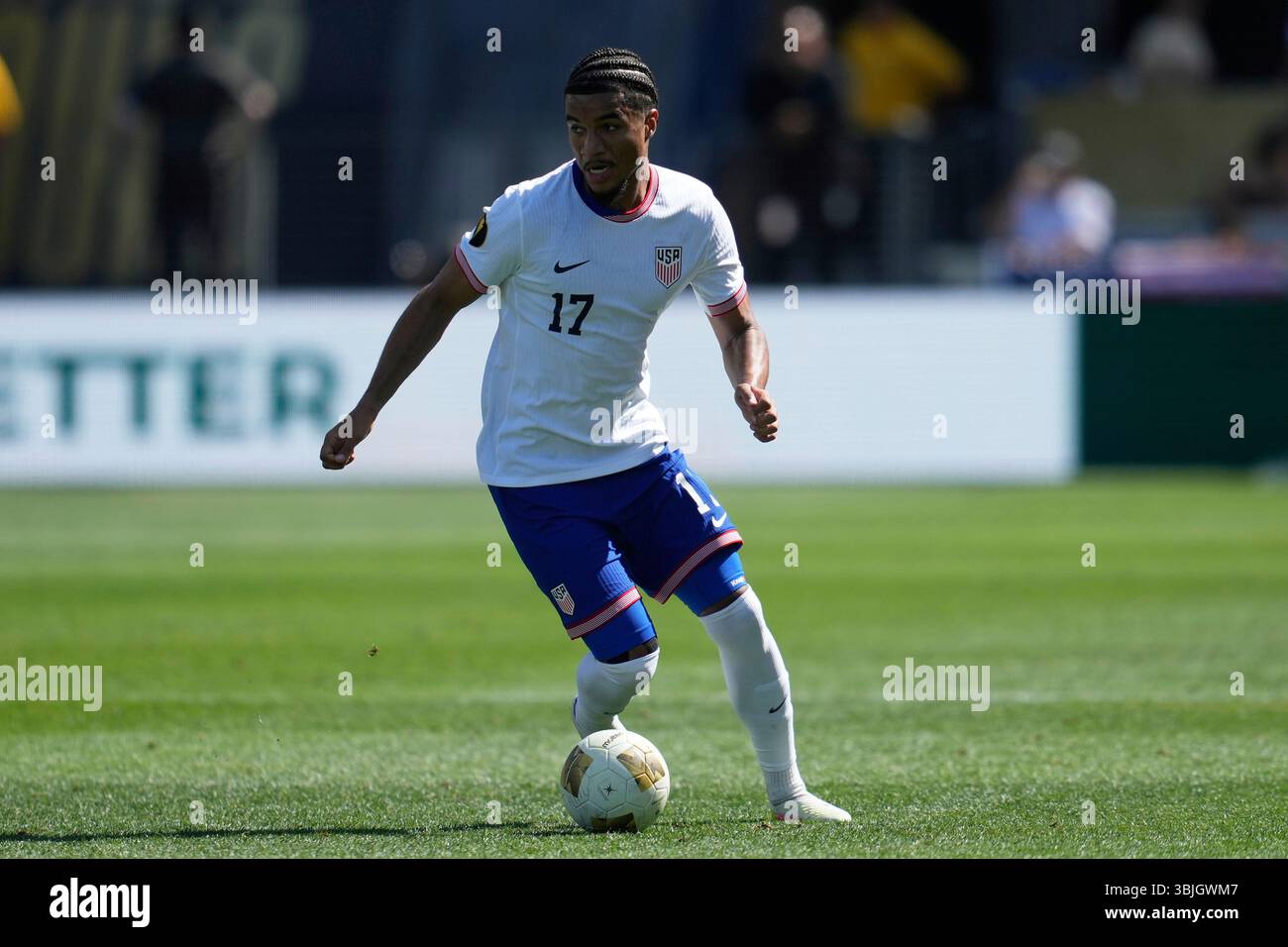 United States forward Malik Tillman (17) brings the ball up the field ...