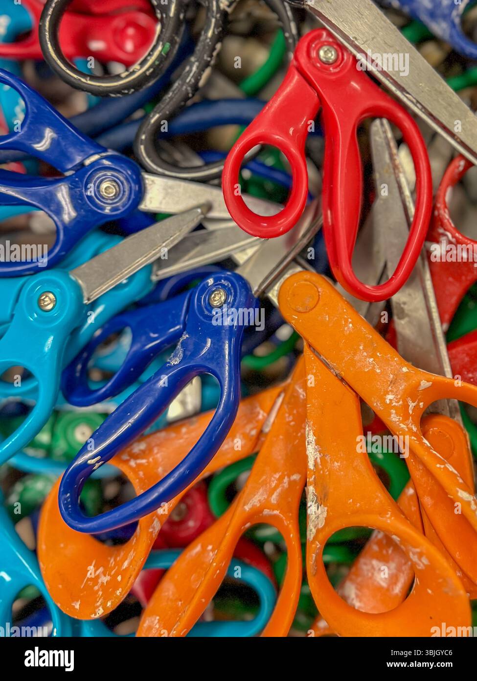 Color photo of a box of multiple plastic and stainless steel arts and ...