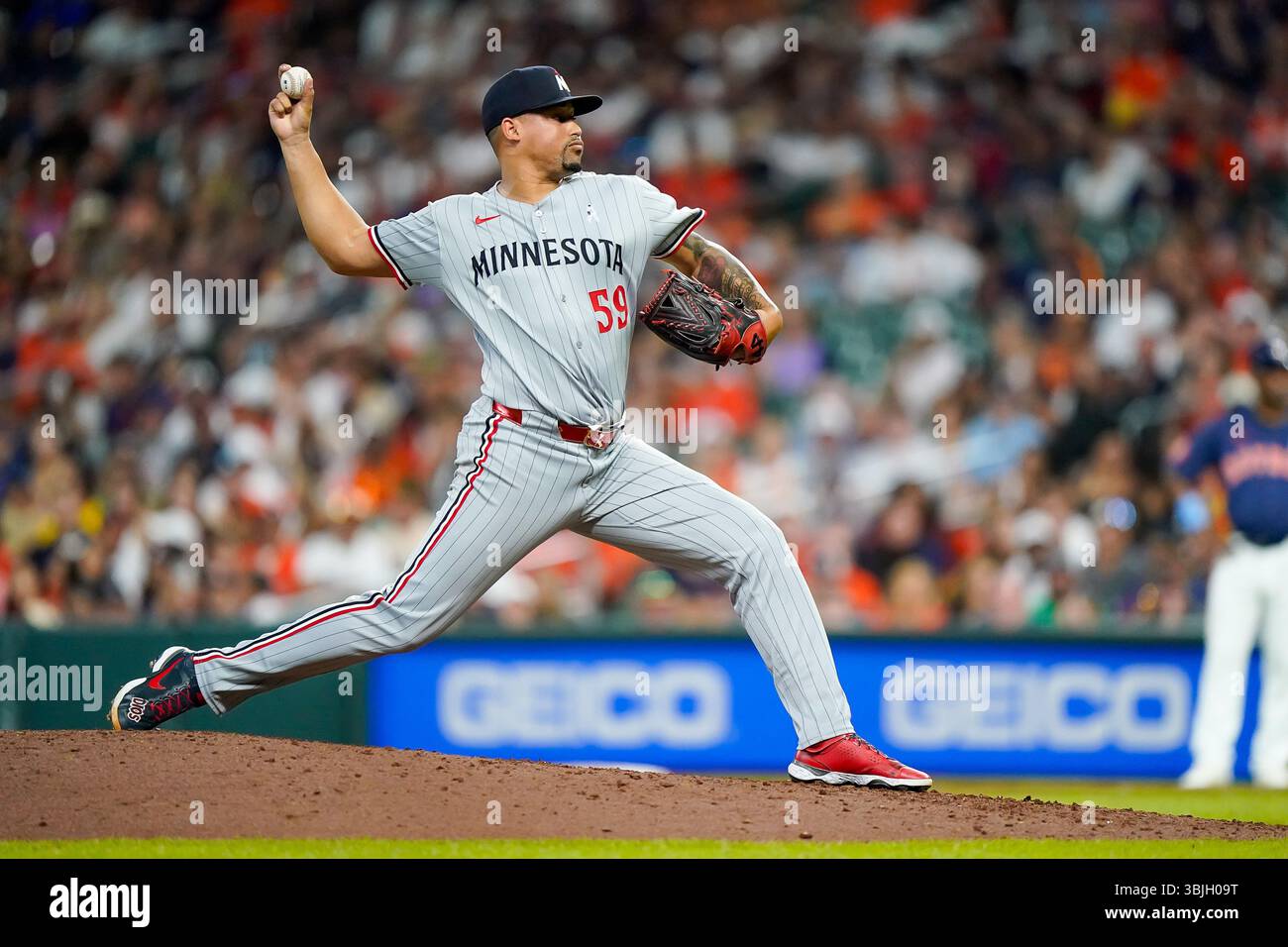 Minnesota Twins pitcher Jhoan Duran (59) looks to throw a pitch during ...