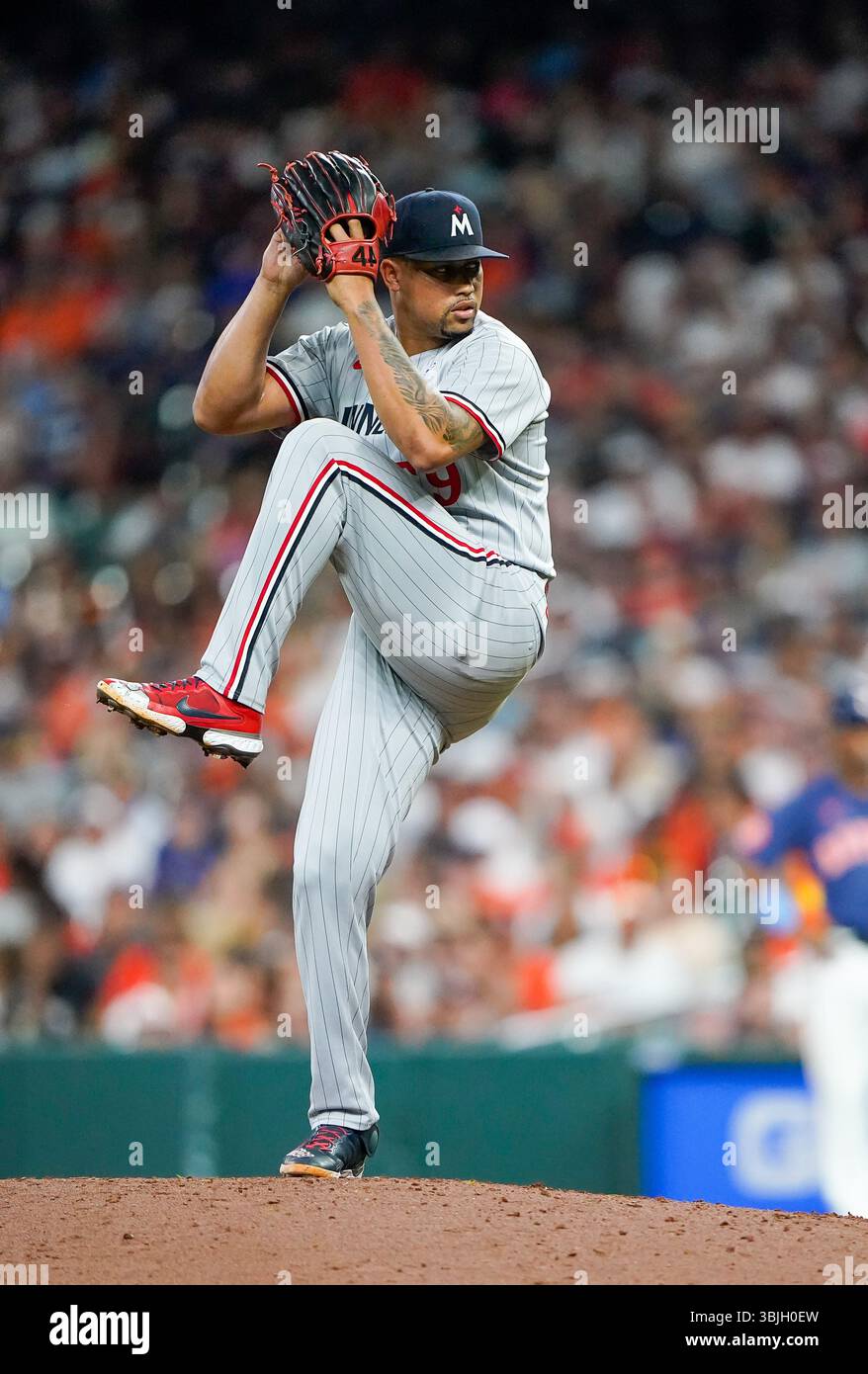 Minnesota Twins pitcher Jhoan Duran (59) looks to throw a pitch during ...