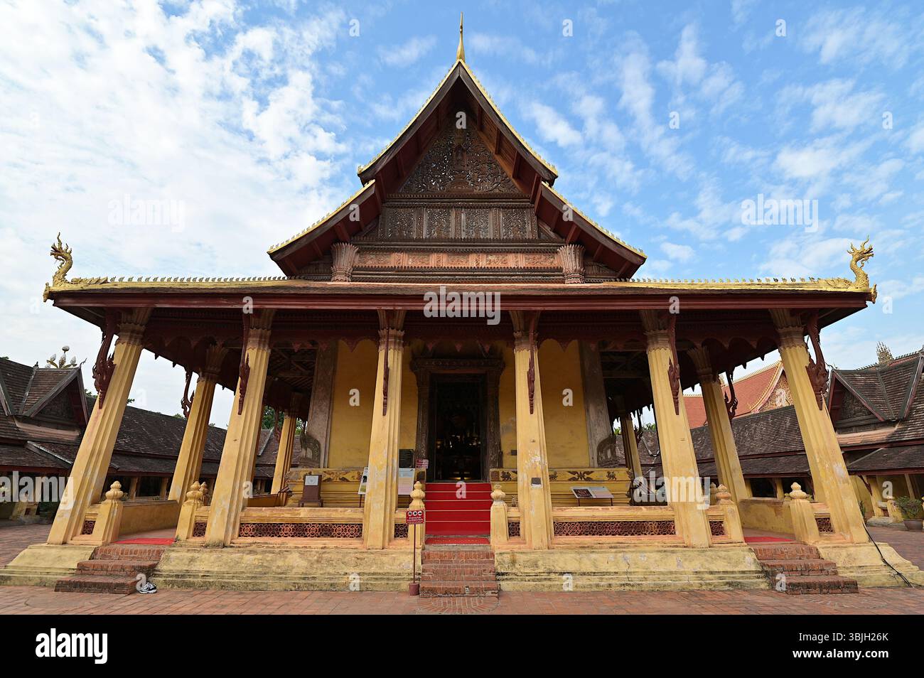 Facade of the sim or ordination hall at Wat Si Saket with its ornate ...