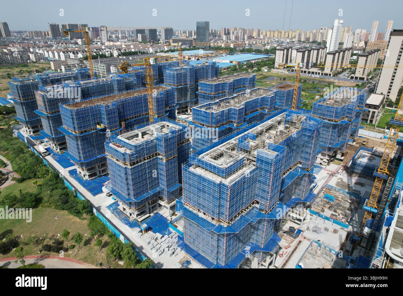 FUYANG, CHINA - JUNE 16, 2025 - A construction site of a commercial ...