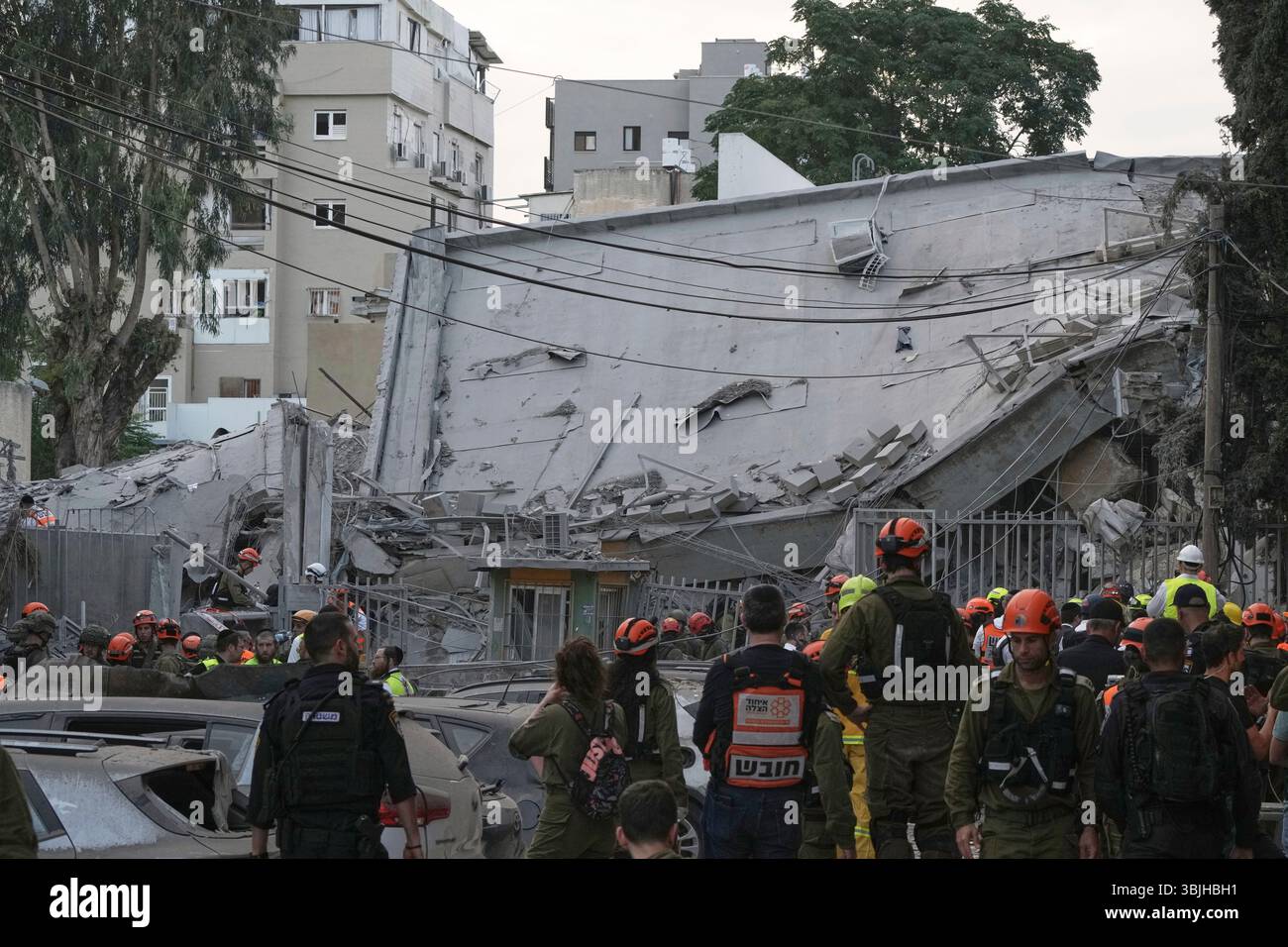 Home Front Command unit soldiers works at the site where an Iranian ...