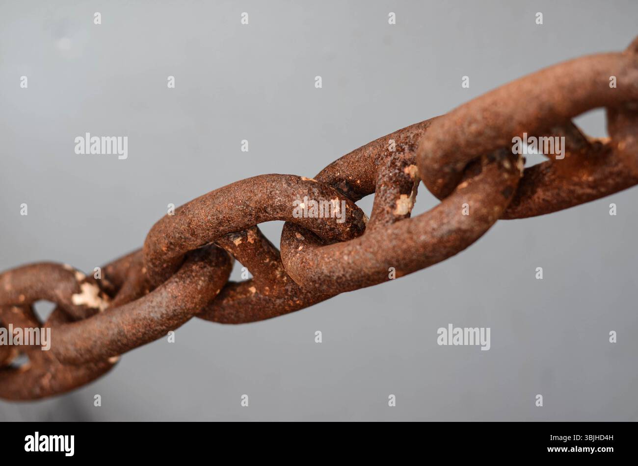 The rusty but fully operational anchor chain on board of offshore ...