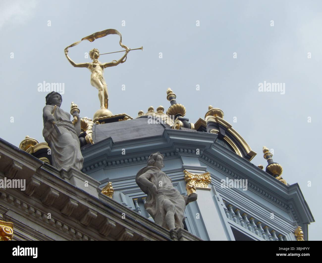 Ornate Historical Building Facade with Golden Details and Sculptures ...