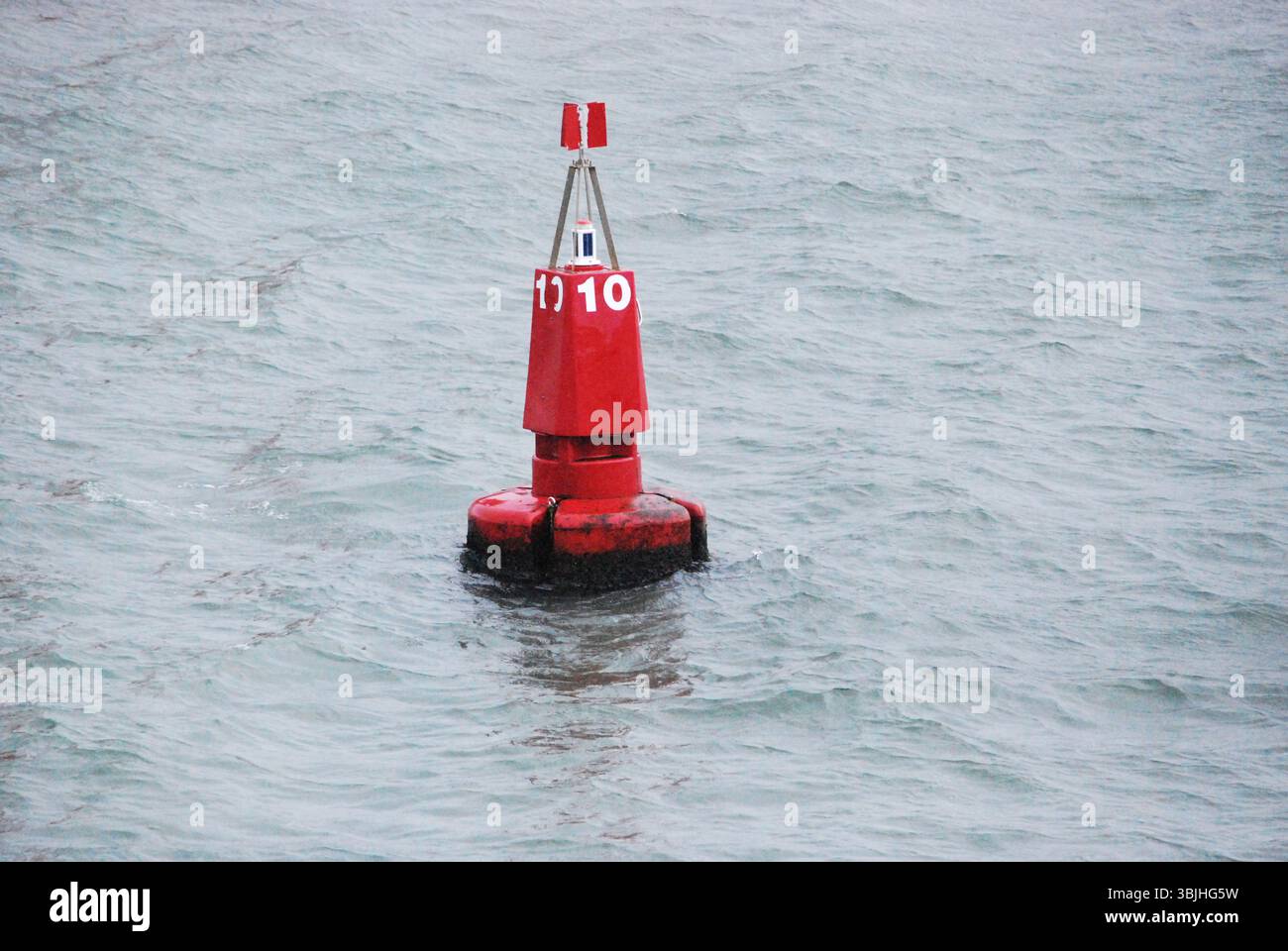 Red Navigational Buoy Floating in Calm Open Ocean Waters.Dover, UK ...