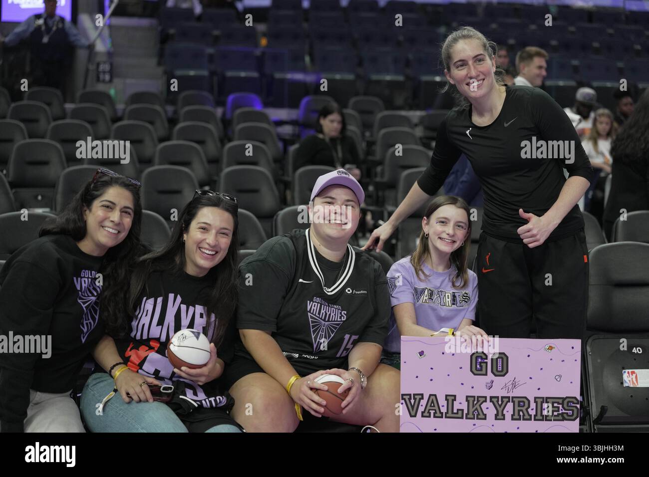 Golden State Valkyries guard Kate Martin (20) poses with a group of ...
