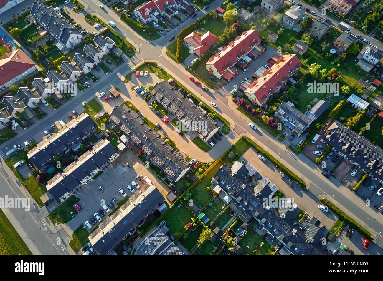 Aerial view of residential suburban area with rows of houses, streets ...