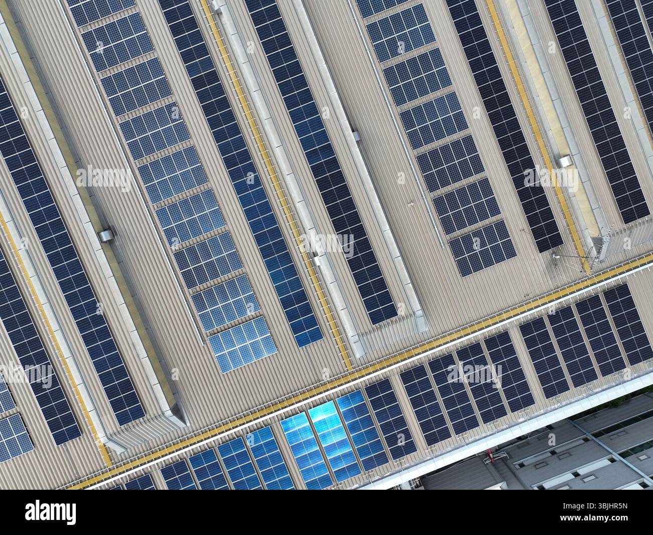 Solar-powered warehouse facility. Modern distribution center with ...