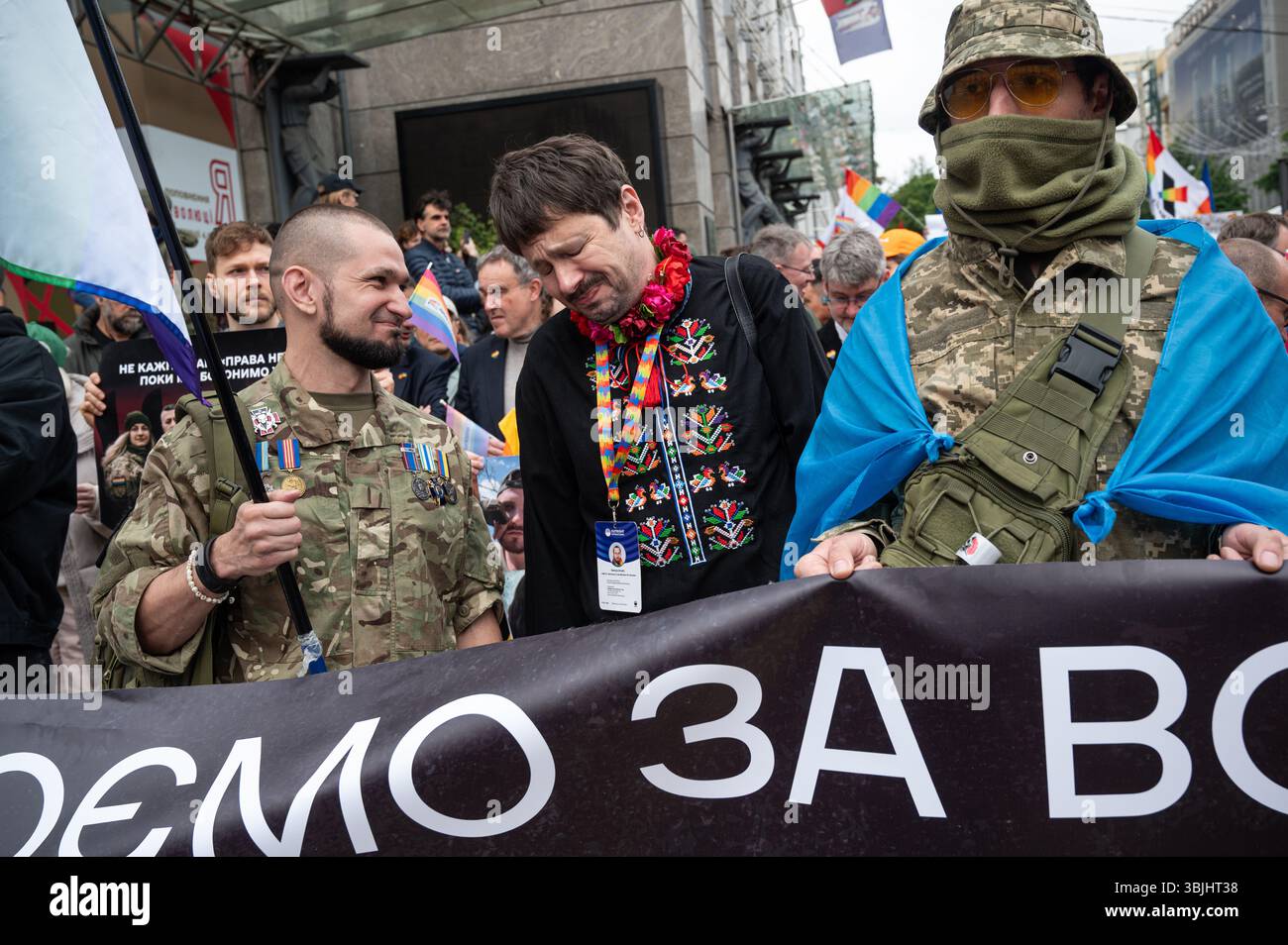 Activists in camouflage uniforms join the KyivPride Equality March 2025 ...