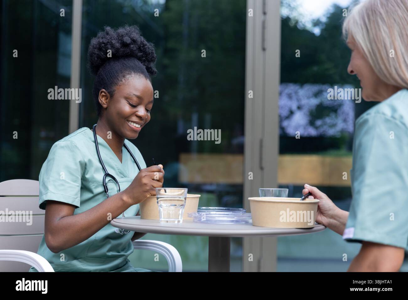 Doctors colleagues having lunch together in the cafe Stock Photo - Alamy