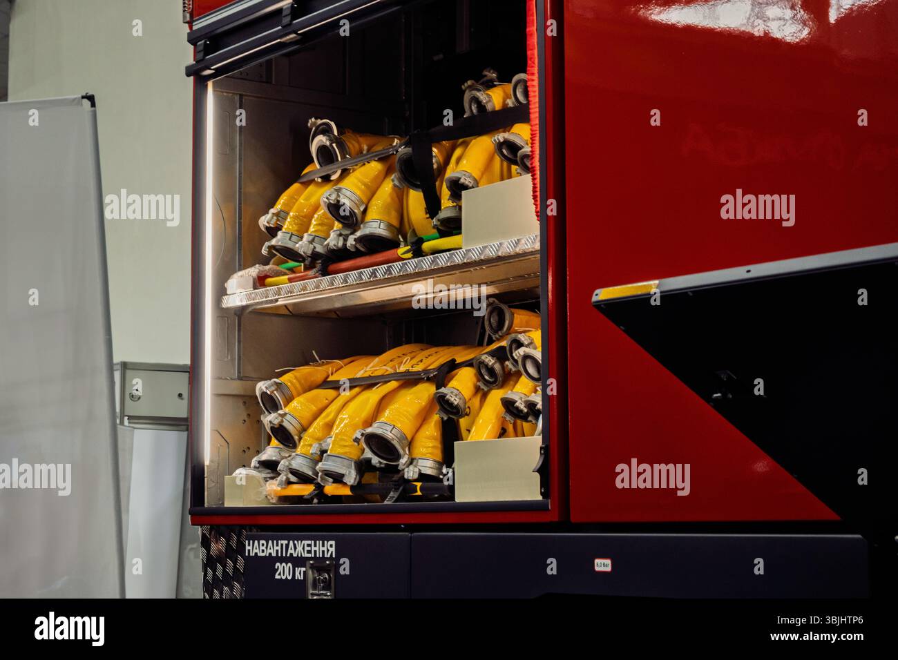Neatly Organized Fire Hose Storage Compartment on a Firetruck Emergency ...