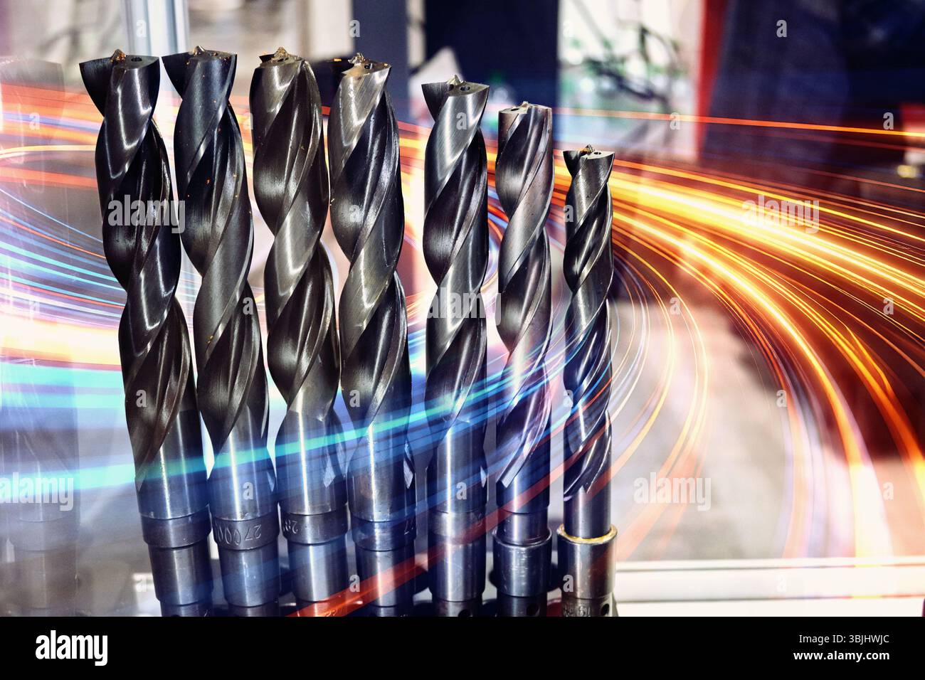 Sharp industrial drill bits with dynamic light trails overlay. Tools ...