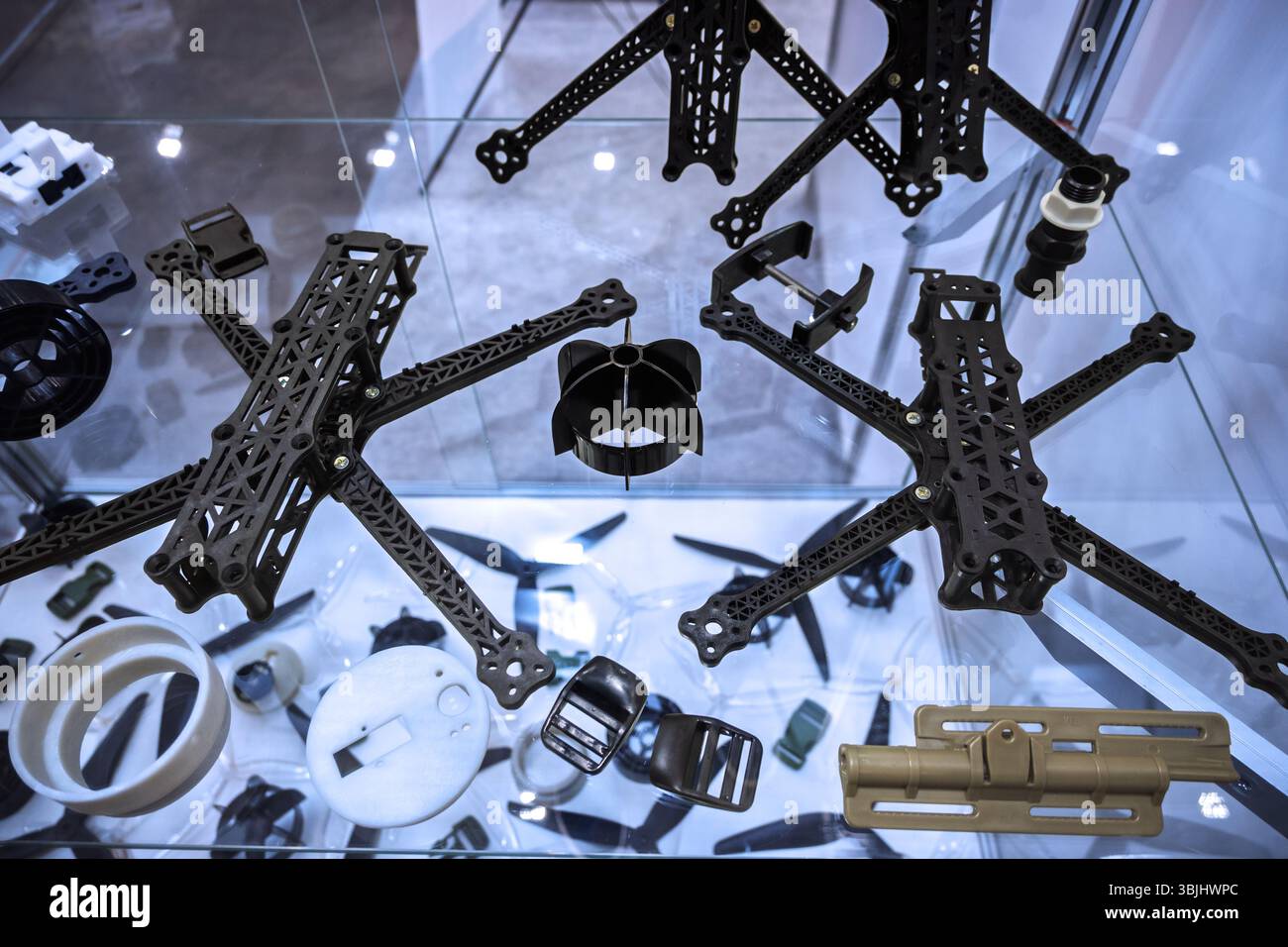 Close-up view of various 3D printed drone components and frames ...