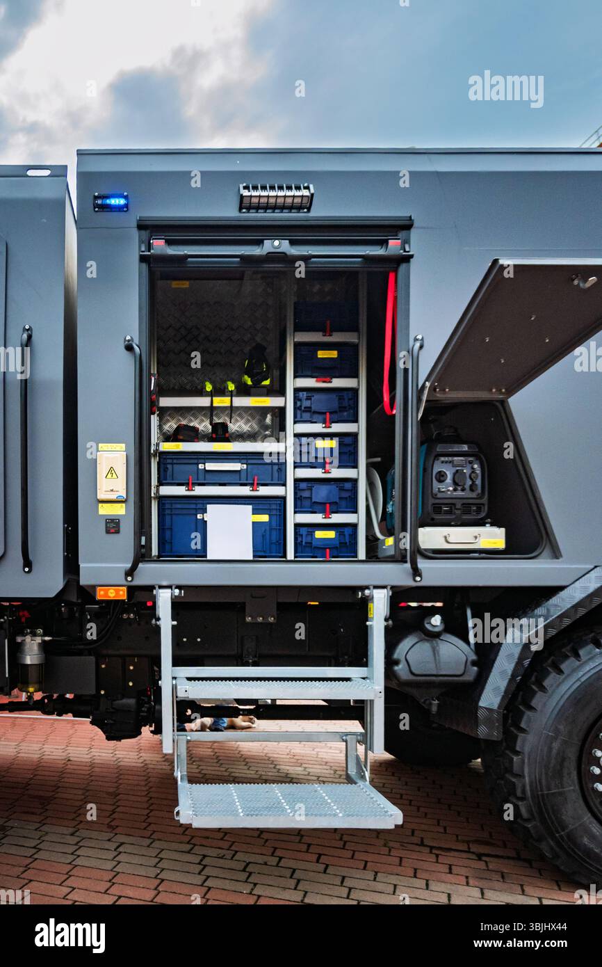 Armored demining vehicle with open equipment compartment, showcasing ...