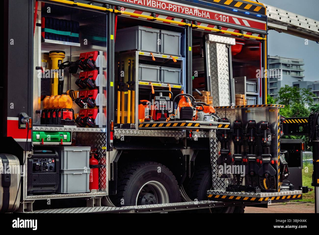 Detailed side view of a fire truck compartment showcasing specialized ...