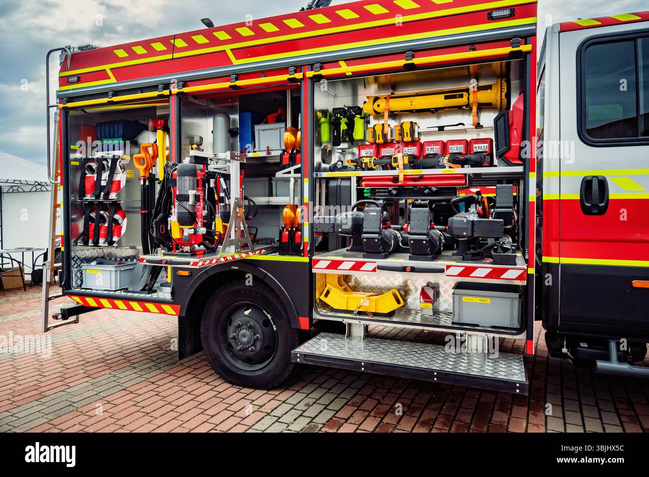 Side view of fire engine equipment compartment hi-res stock photography ...