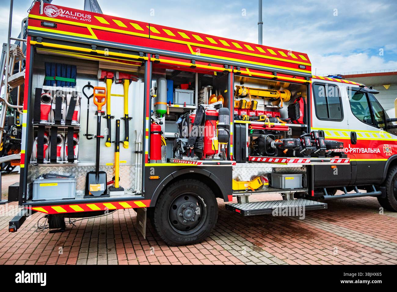 Side view of fire engine equipment compartment hi-res stock photography ...