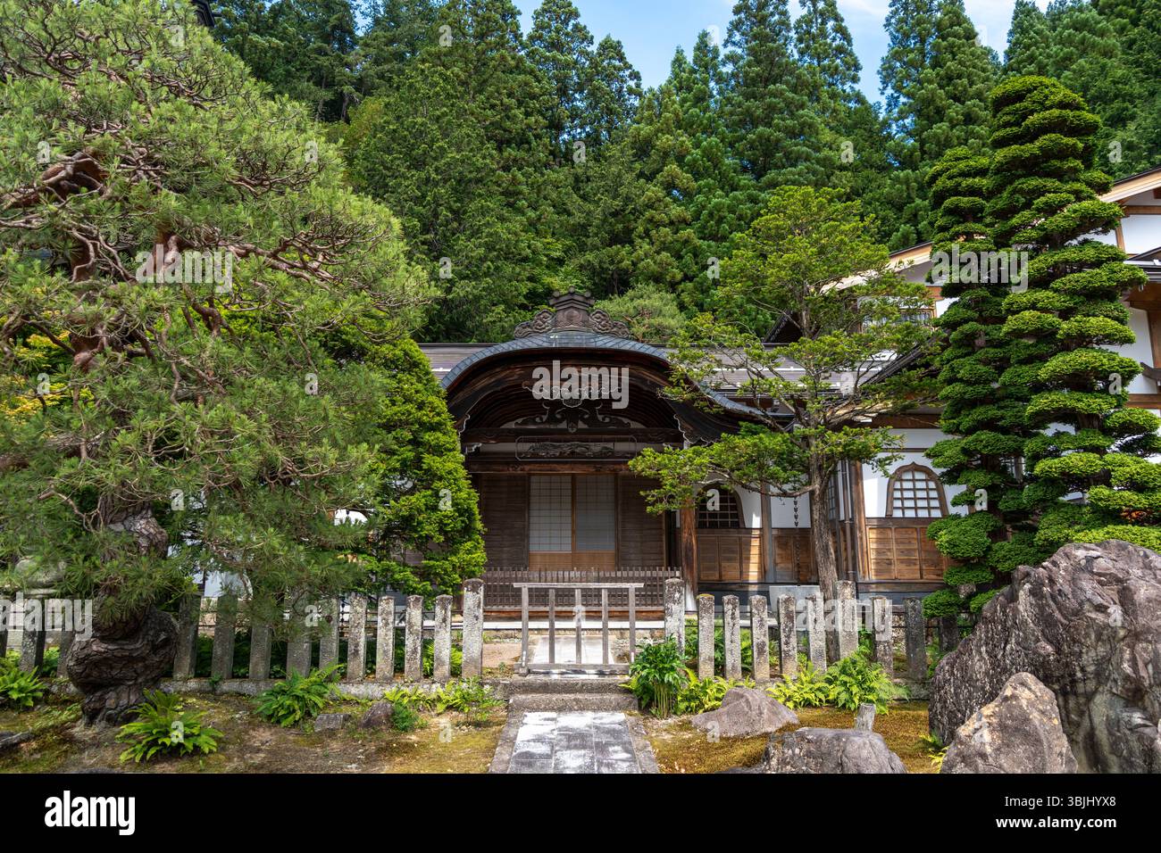 Traditional wooden structures and manicured gardens surround the main ...