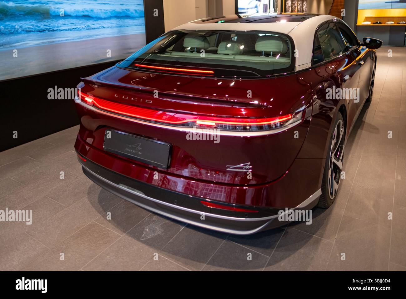 deep red electric Lucid Air, battery electric 4-door luxury sedan ...