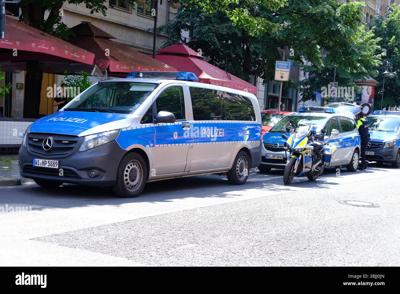police cars on streets germany, law enforcement officers guarding order ...