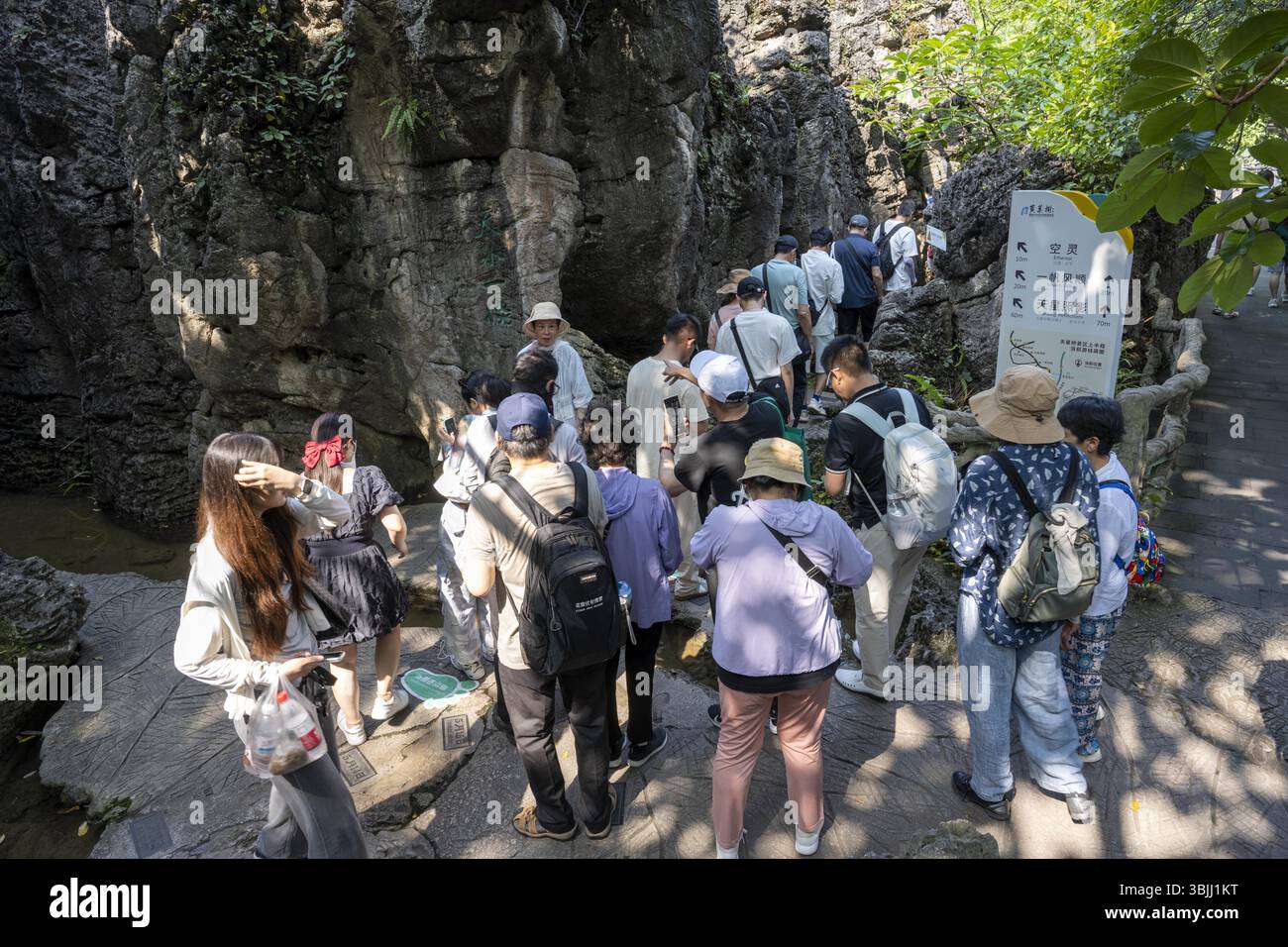 Tourists visit the Huangguoshu Waterfall scenic area in Guiyang City ...