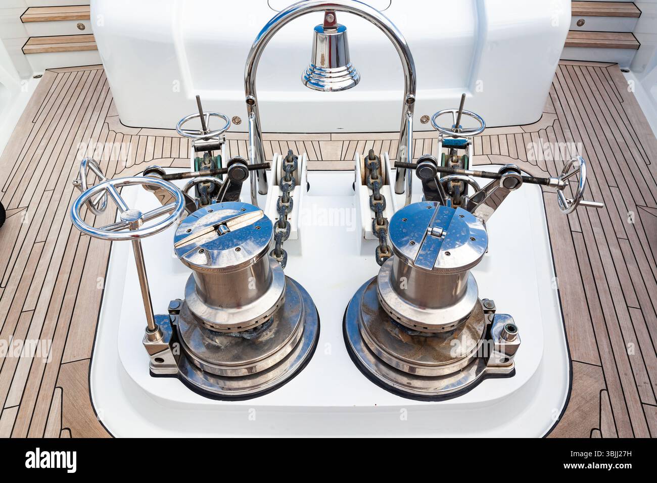 Bow part of the yacht with anchor stops, part of the anchor chain and ...