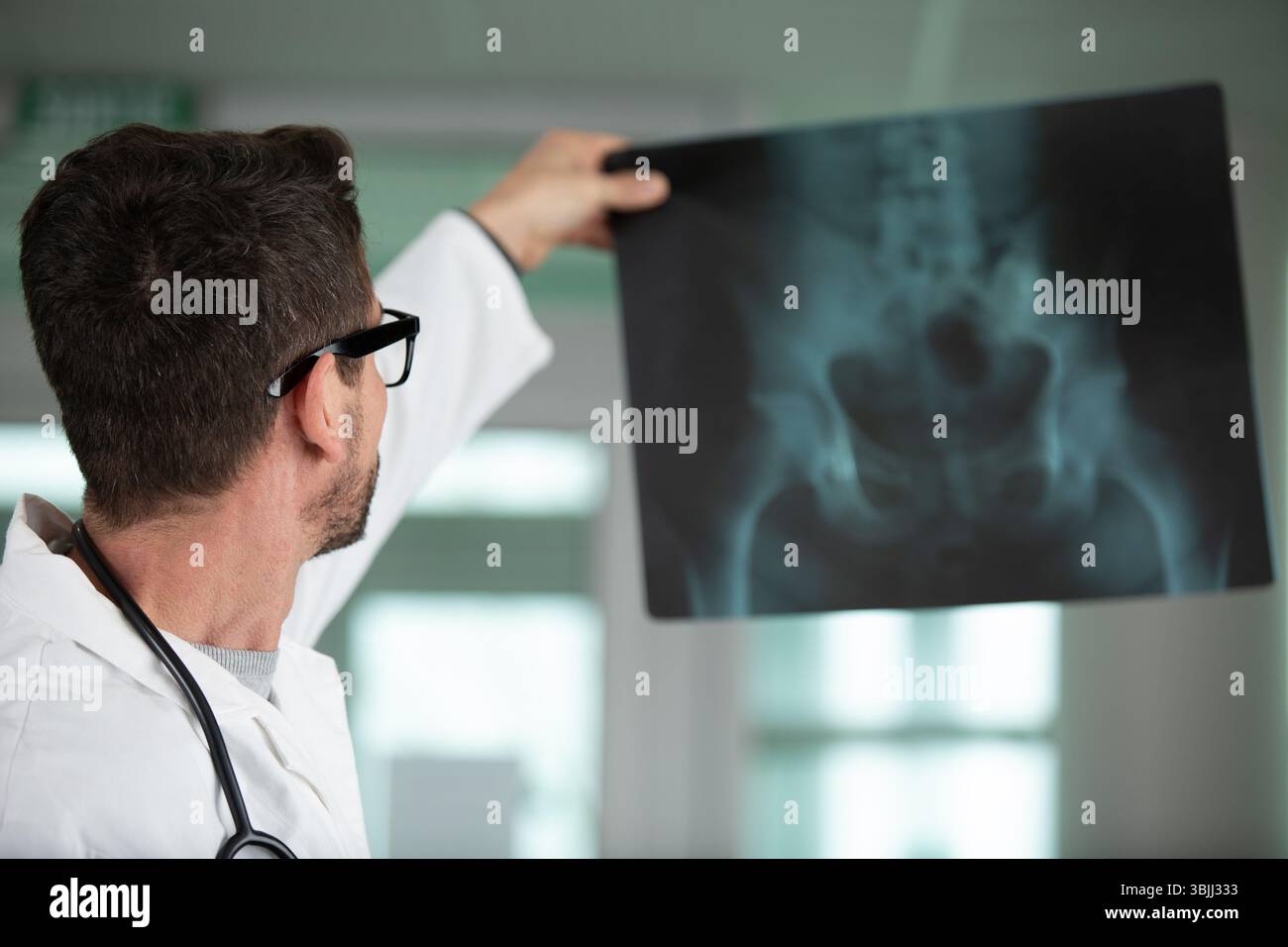 doctor man looking at x-ray radiography doing body examination Stock ...