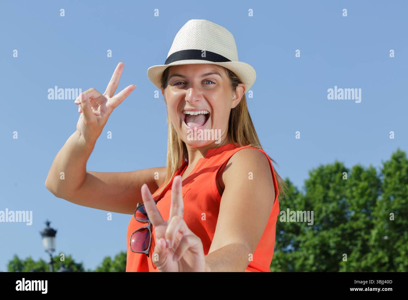Tourist pose peace sign hi-res stock photography and images - Alamy