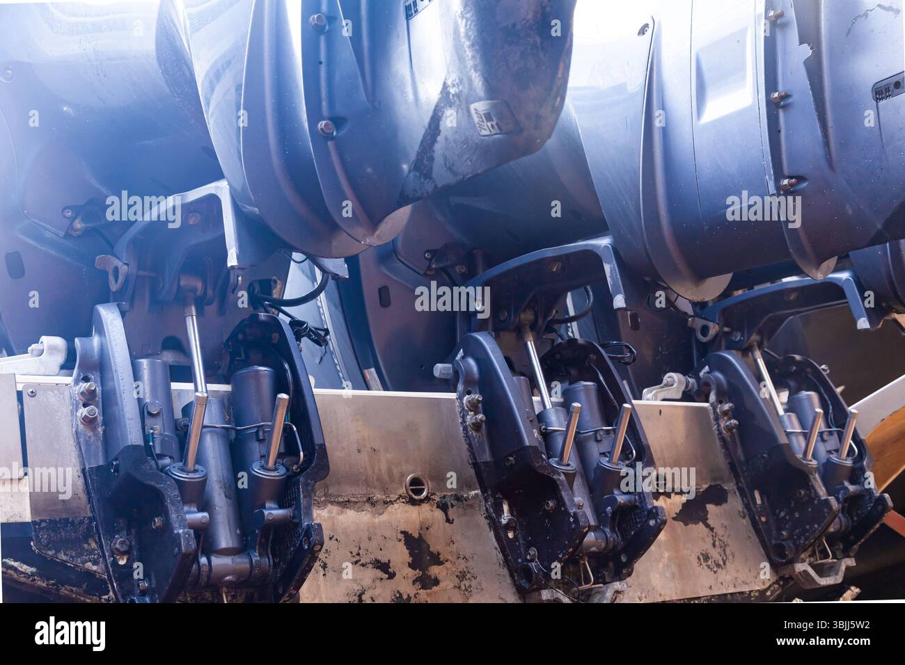 Lifting mechanisms on outboard motors at the stern of the boat. Transom ...