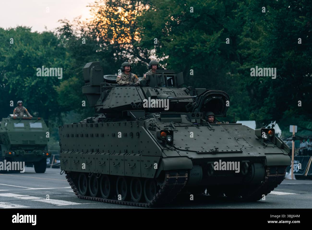 U.S. Army Soldiers assigned to the 1st Cavalry Division, drive an M2 ...
