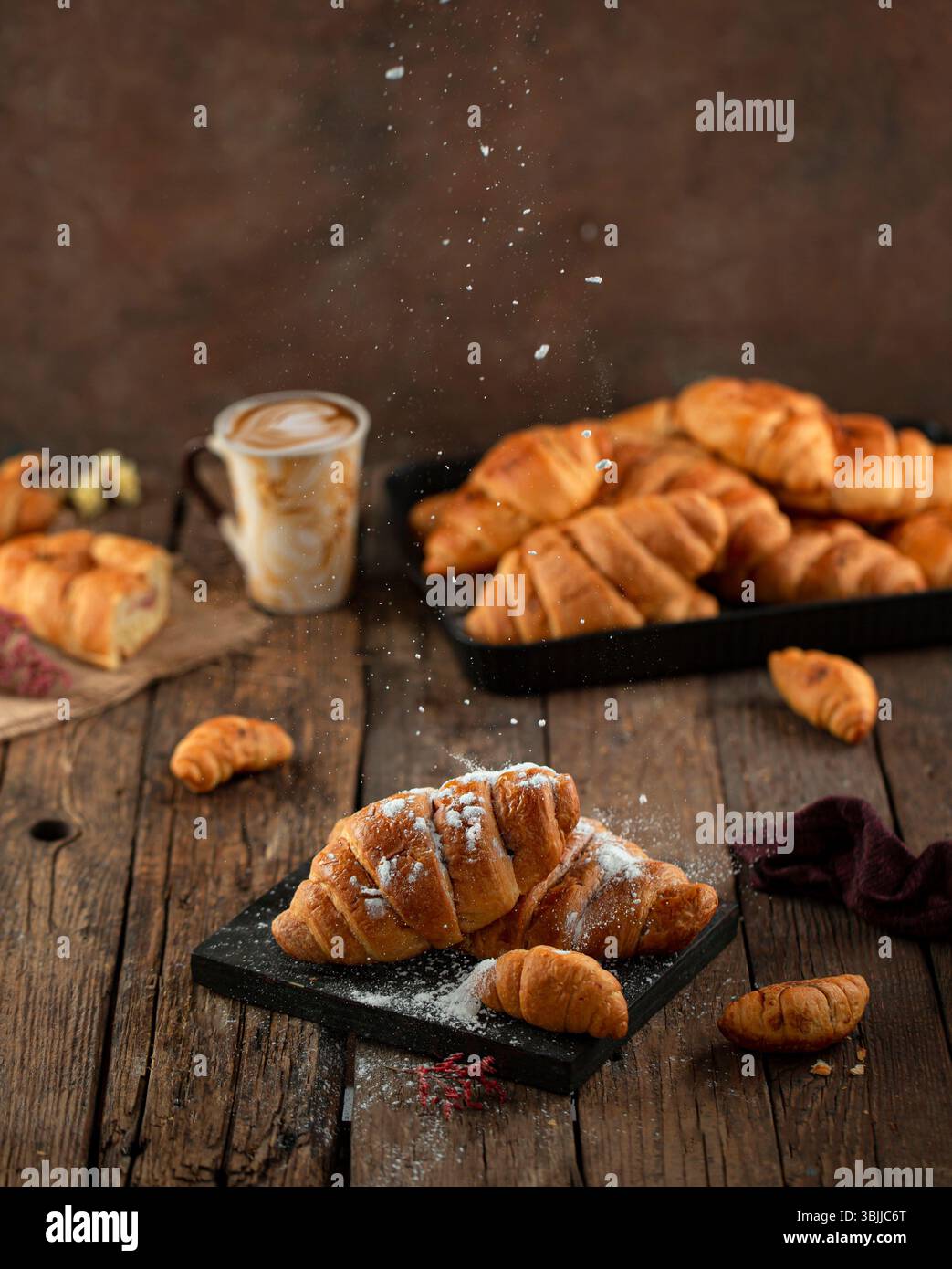 French breakfast croissant with powdered sugar topping Stock Photo - Alamy