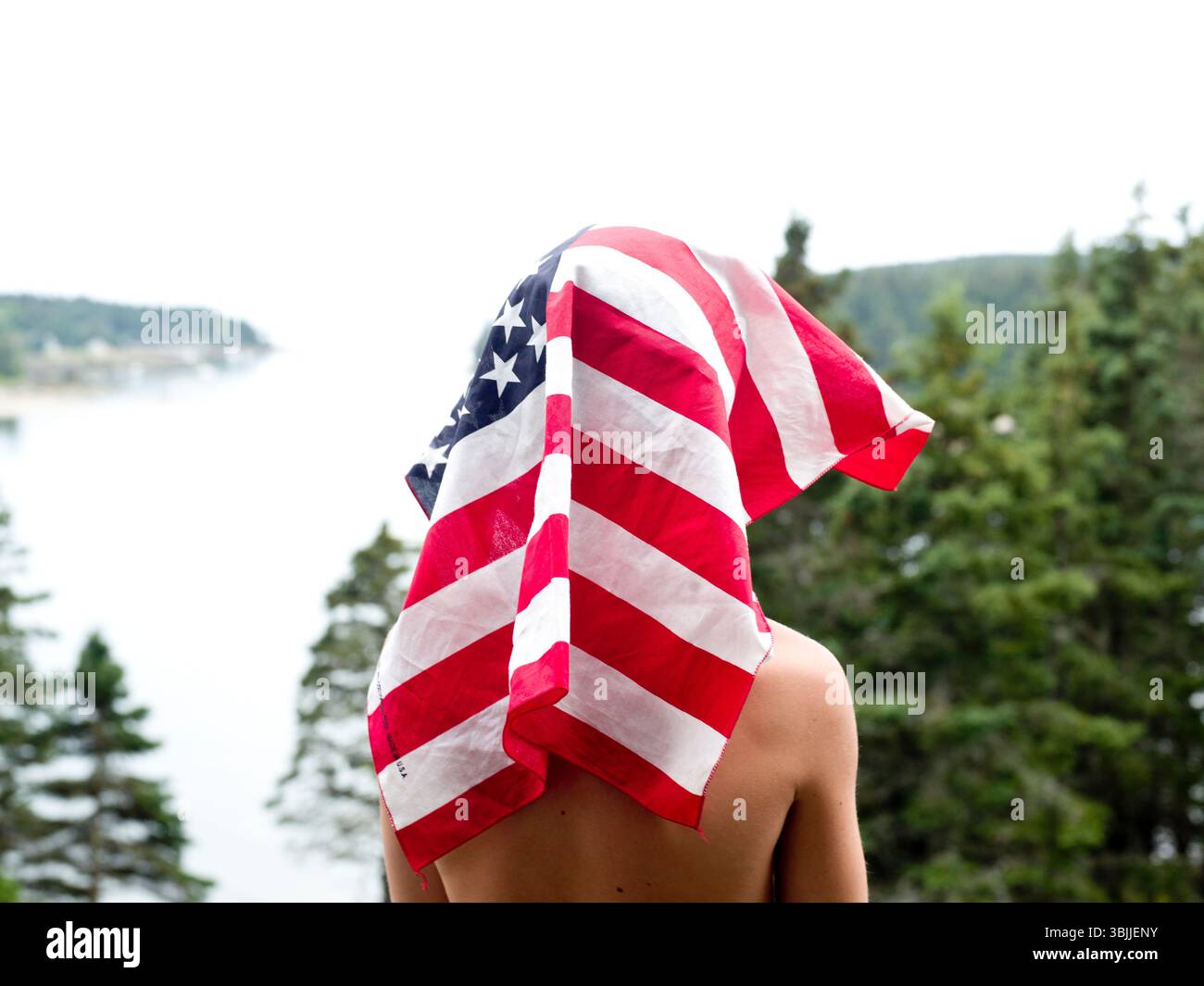 a boy poses with the american flag Stock Photo - Alamy