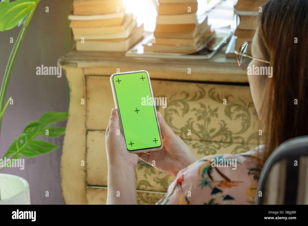 cell phone blank green screen mockup. woman holding mobile phone in ...