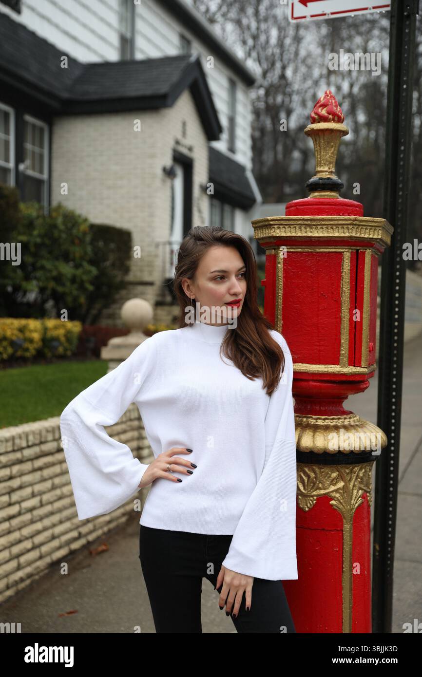 Young woman with red lipstick next to a fire hydrant in New York Stock ...