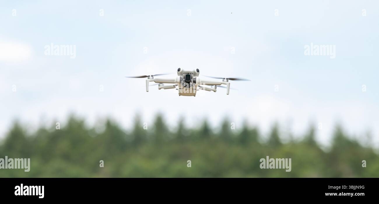 Flying drone in action, aerial copter, digital camera, modern ...