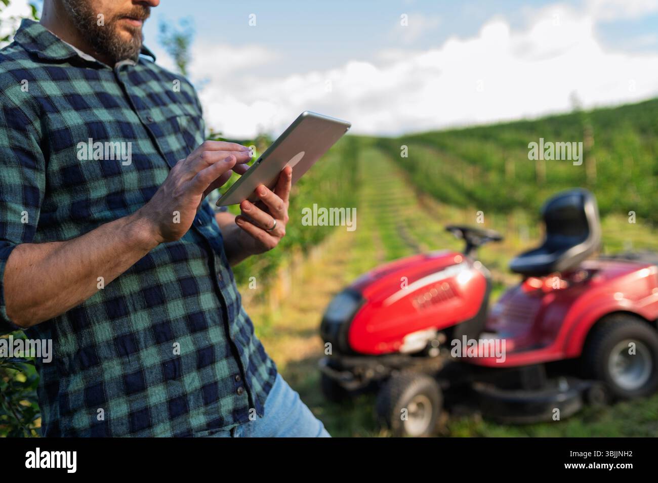 Monitoring orchard health with smart farming technology Stock Photo - Alamy