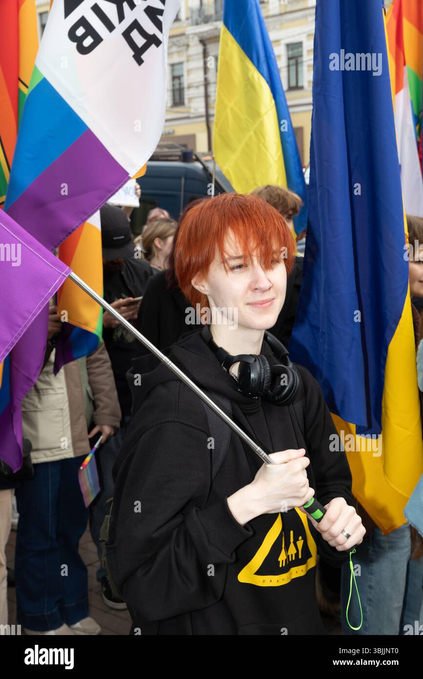 Kyiv, Ukraine - Jun. 14, 2025: A young woman with red hair smiles ...