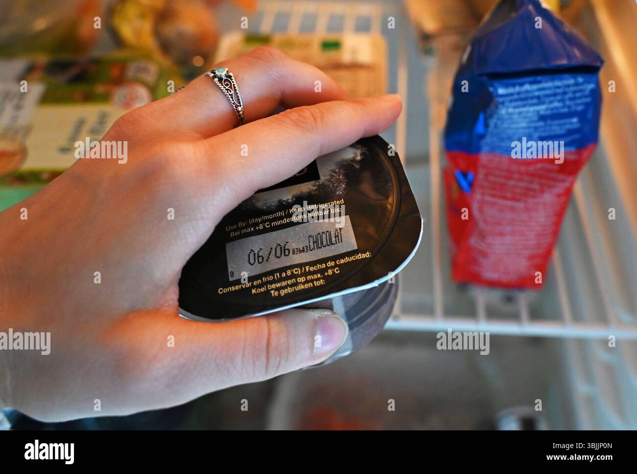 Berlin, Germany. 10th June, 2025. A woman reaches for a pudding pot in ...