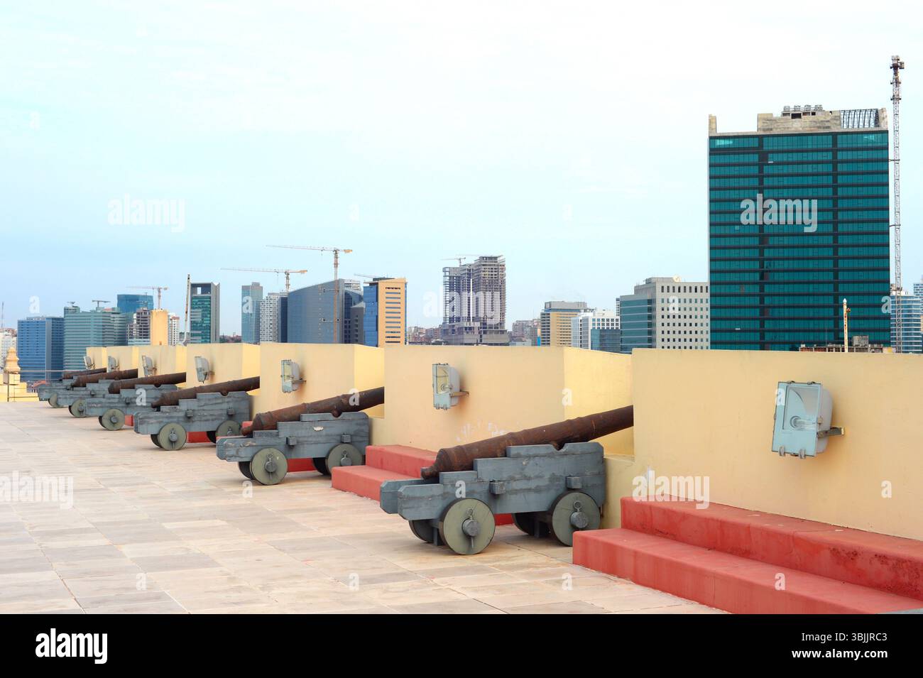 Cannons at Fortaleza de Sao Miguel and modern Luanda Downtown in the ...