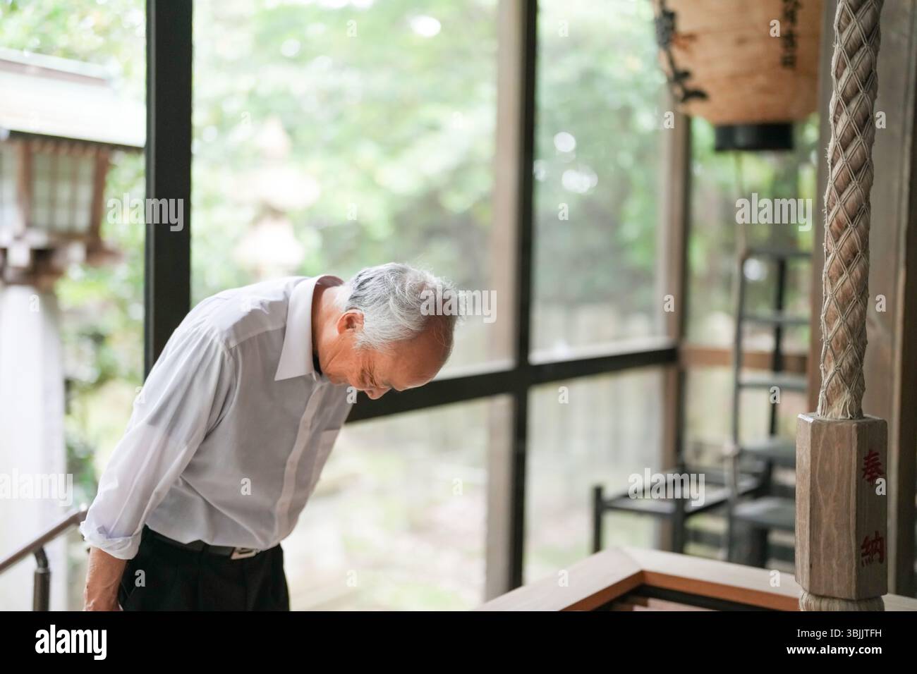 In rural Japan, a Japanese man in his late 70s visits a countryside ...