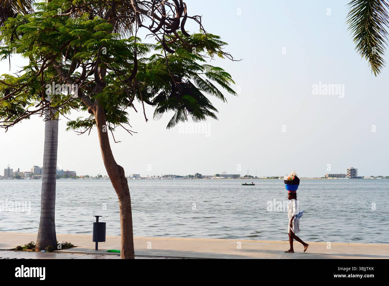Woman selling water at Marginal in Luanda, Angola Stock Photo - Alamy