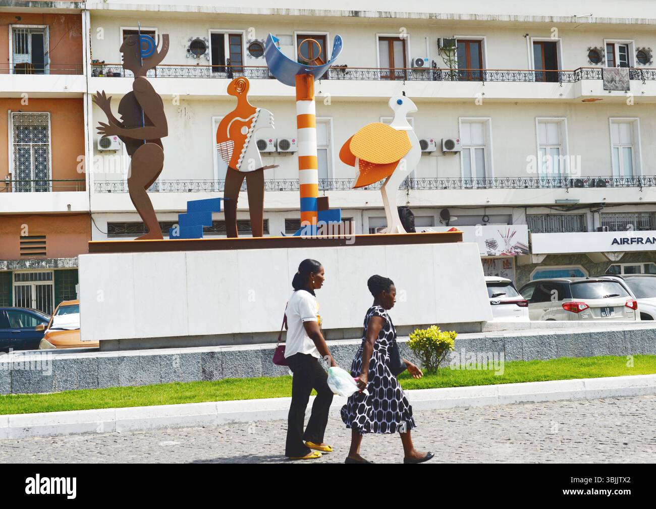 LUANDA, ANGOLA - FEB 06, 2025: People passing by a funny sculpture on ...